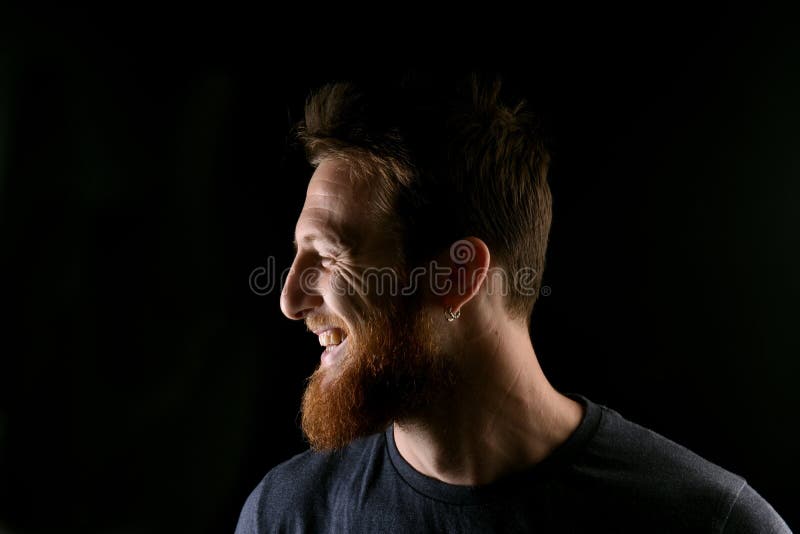 Portrait of Profile of a Smiling Man on Black Background Stock Image ...