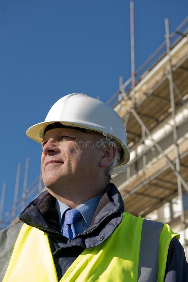 Portrait of a Property Developer / Builder with Construction Site ...