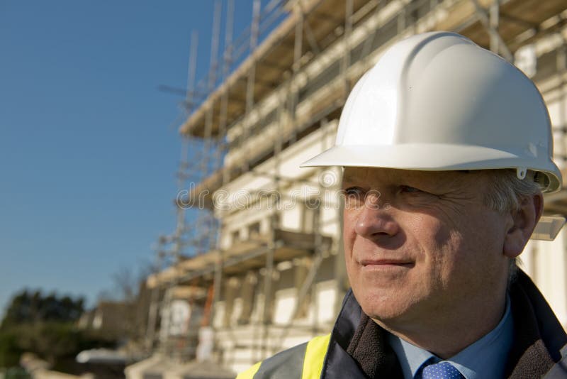 Portrait of a Property Developer / Builder with Construction Site ...