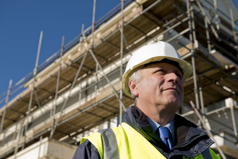 Portrait of a Property Developer / Builder with Construction Site ...