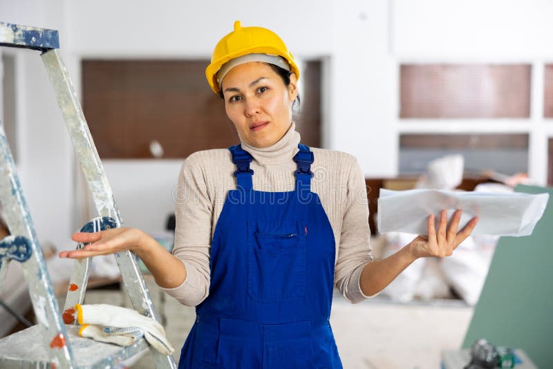 Portrait of Questionable Woman Builder with Documentation Stock Photo ...