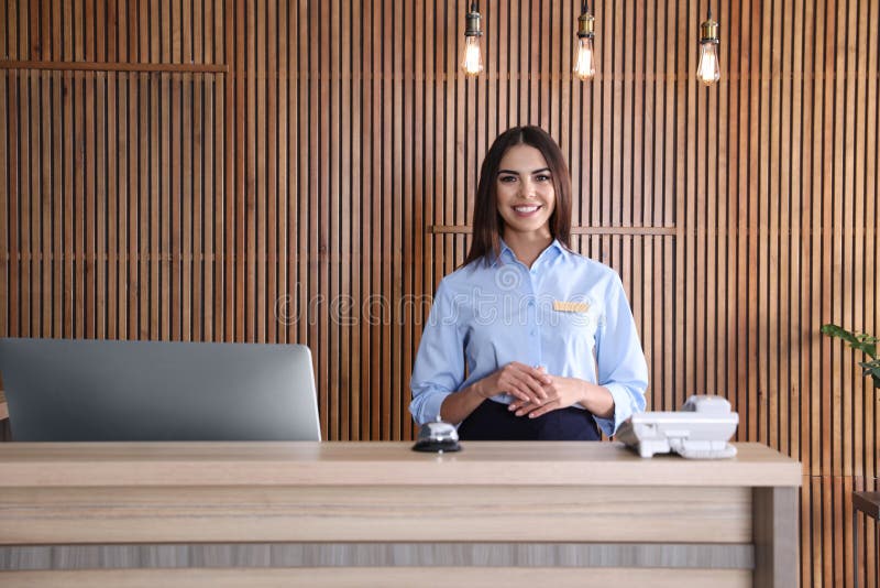 Portrait of Receptionist at Desk in Hotel Stock Photo - Image of ...