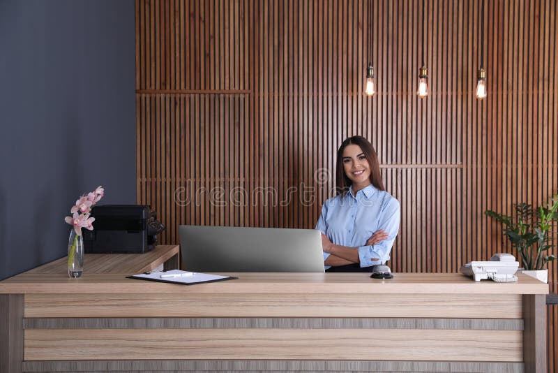 Portrait of Receptionist at Desk Stock Photo - Image of female ...