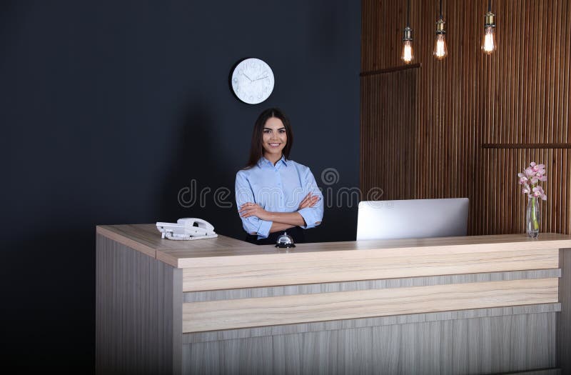 Portrait of Receptionist at Desk Stock Photo - Image of center, female ...
