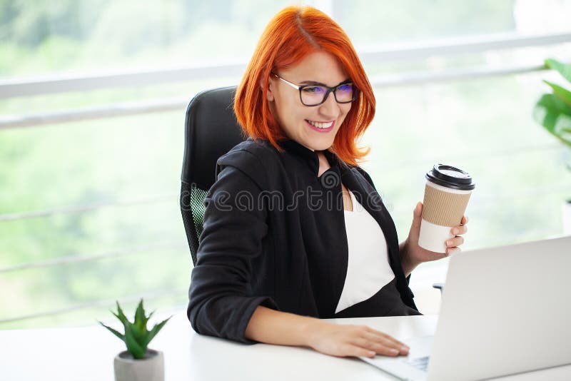 Portrait Red-haired Beautiful Woman Working in the Office. Stock Image ...