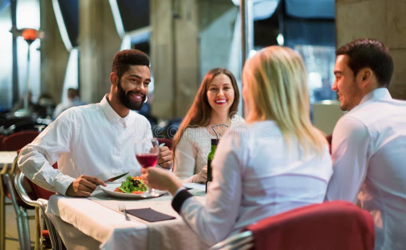 Portrait of Relaxed and Smiling Adults Having Dinner Stock Photo ...