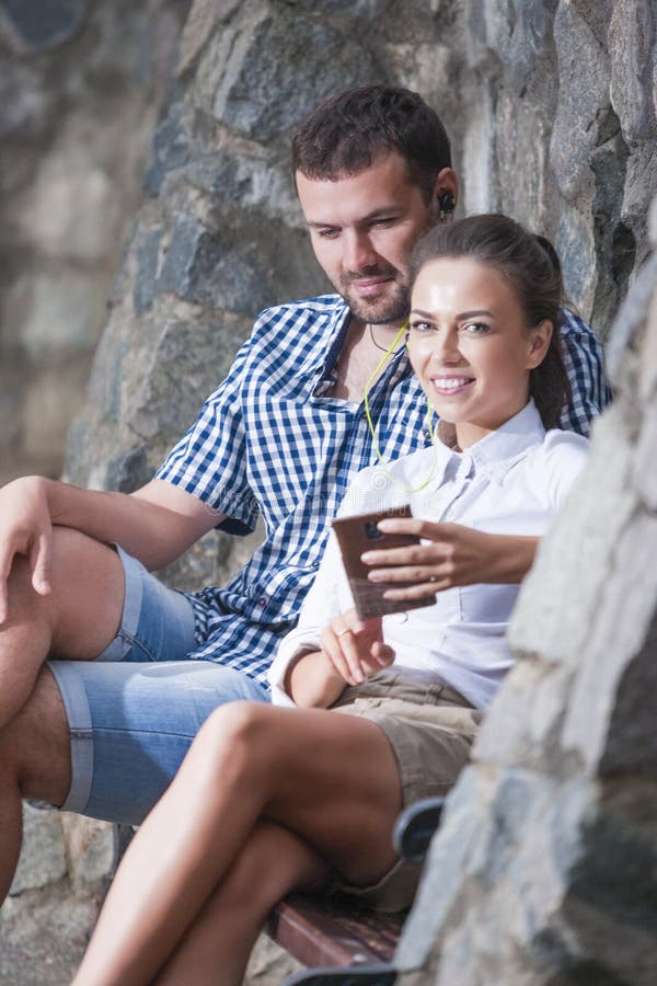 Portrait Of Relaxing Positive Caucasian Couple Sitting Together
