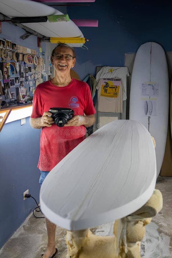 Portrait of Robert August in the Workshop Standing Next To a Surfboard ...