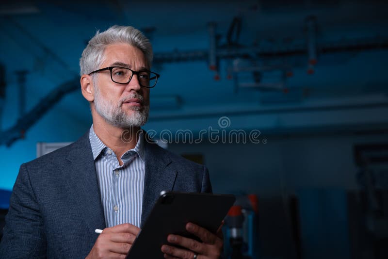 Portrait of Robotics Engineer Holding Tablet, Standing in Laboratory ...