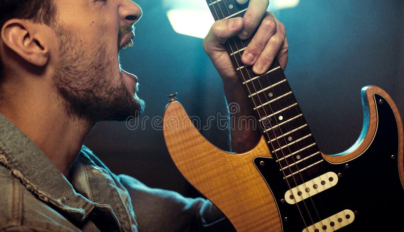 Portrait of a Rock Star Playing a Guitar Stock Image - Image of ...