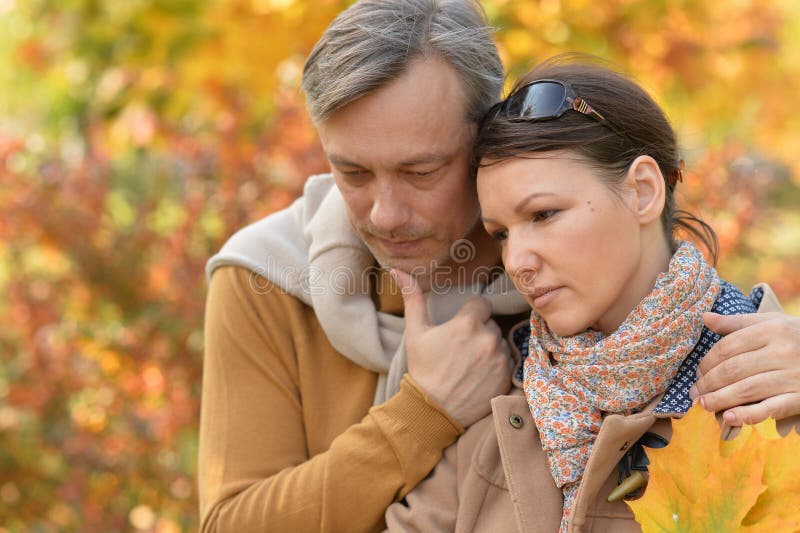 Portrait of Sad Couple Posing in Autumnal Park Stock Image - Image of ...