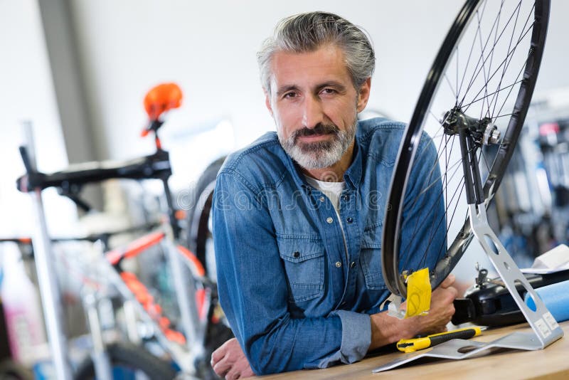 Portrait Salesman in Bicycle Shop Stock Image - Image of manager, sales ...