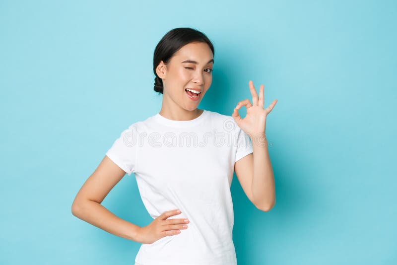 Portrait Of Sassy And Confident Pretty Asian Girl 20s In White T Shirt