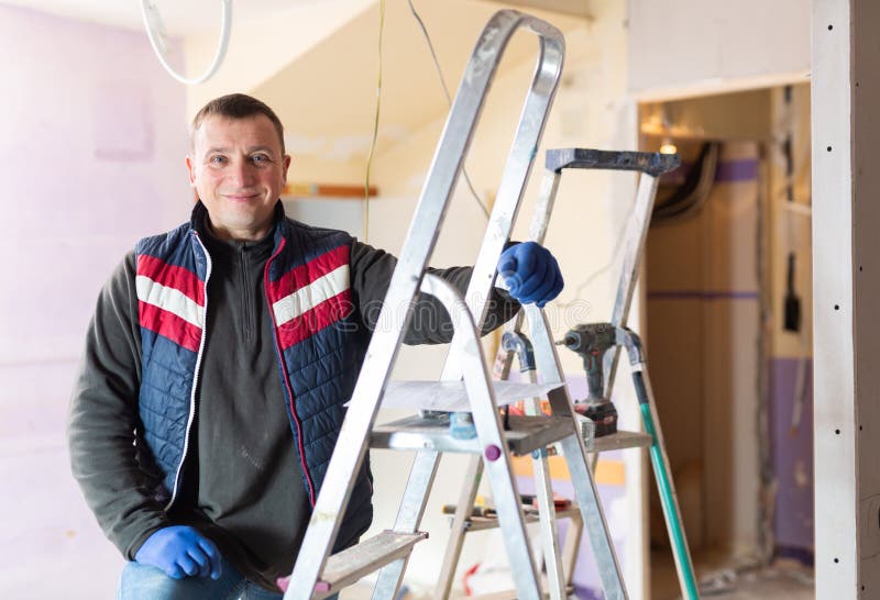 Portrait of Friendly Construction Worker Standing at Indoors Building ...