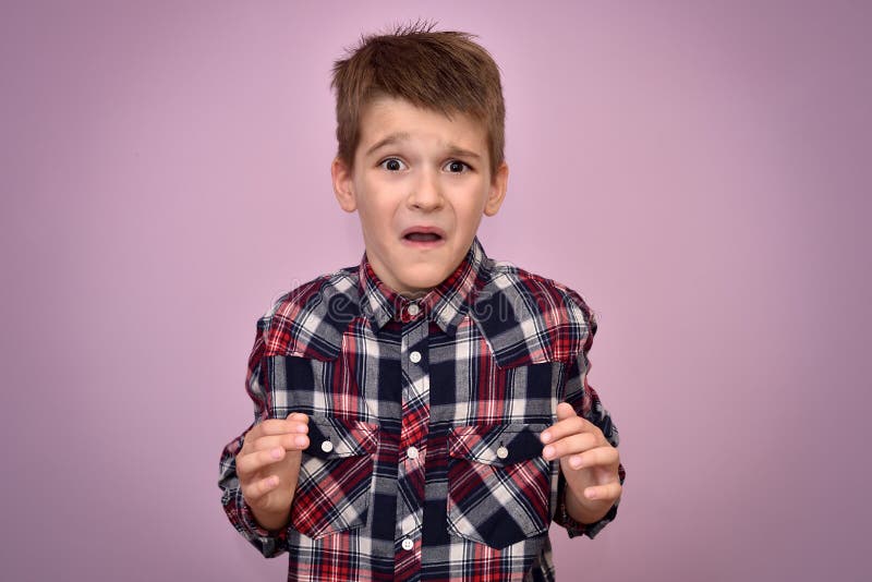 Scared young boy stock photo. Image of disappointed - 129799738
