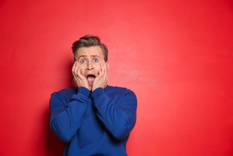 Portrait of Scared Young Man on Color Background Stock Image - Image of ...