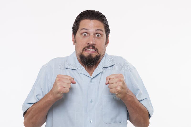 Portrait of a Scared Young Man Standing Against White Stock Image ...