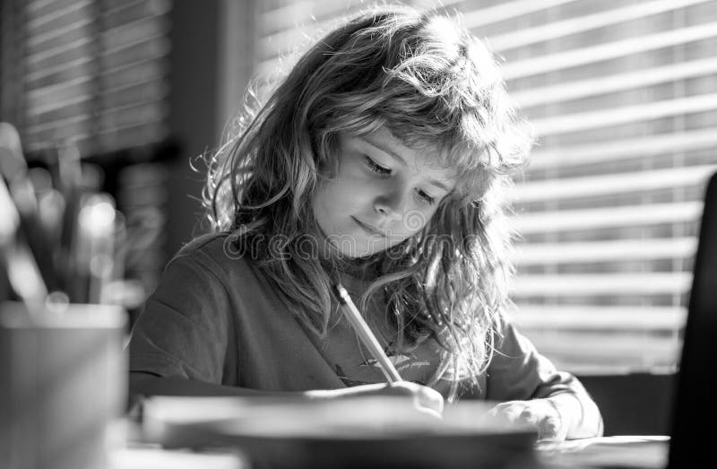 Portrait School Kid Siting on Table Doing Homework. Concentrated ...