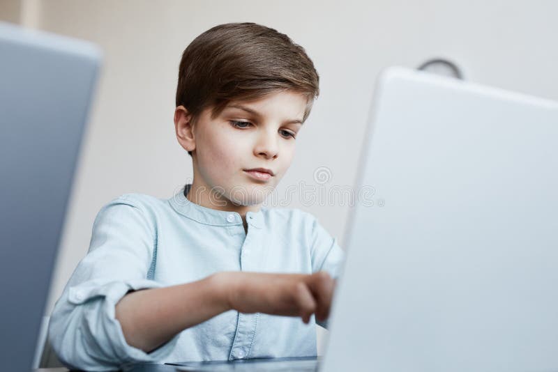 Boy Using Computer in School Stock Photo - Image of studying, education ...