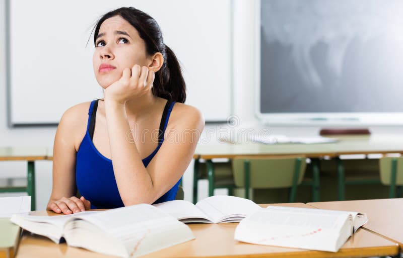 Portrait Schoolgirl Who is Solving a Difficult Task at the Desk Stock ...