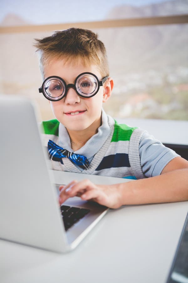 Portrait of Schoolkid Using Laptop in Classroom Stock Photo - Image of ...