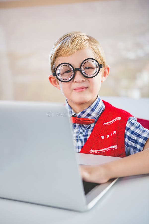 Portrait of Schoolkid Using Laptop in Classroom Stock Photo - Image of ...