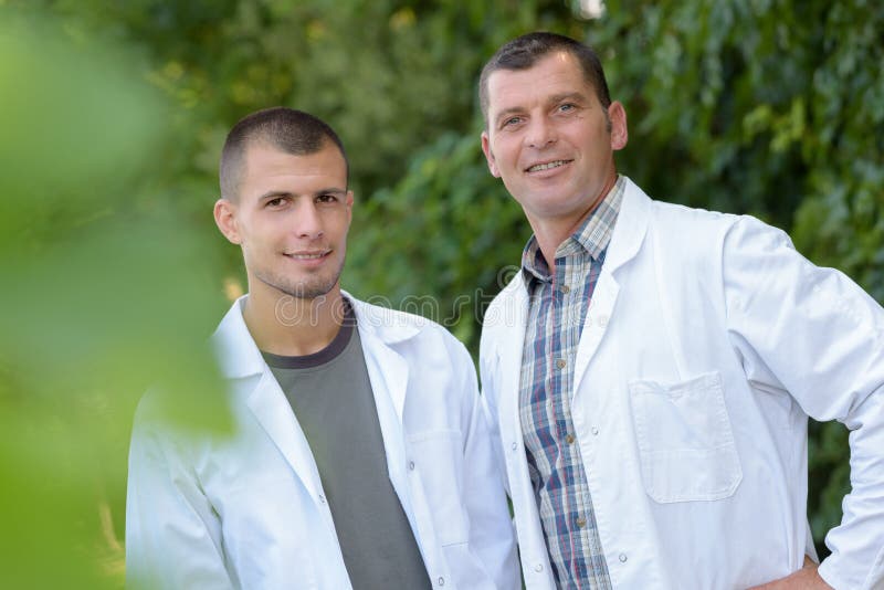 Portrait Scientists Checking Plants Outdoors Stock Photo - Image of ...