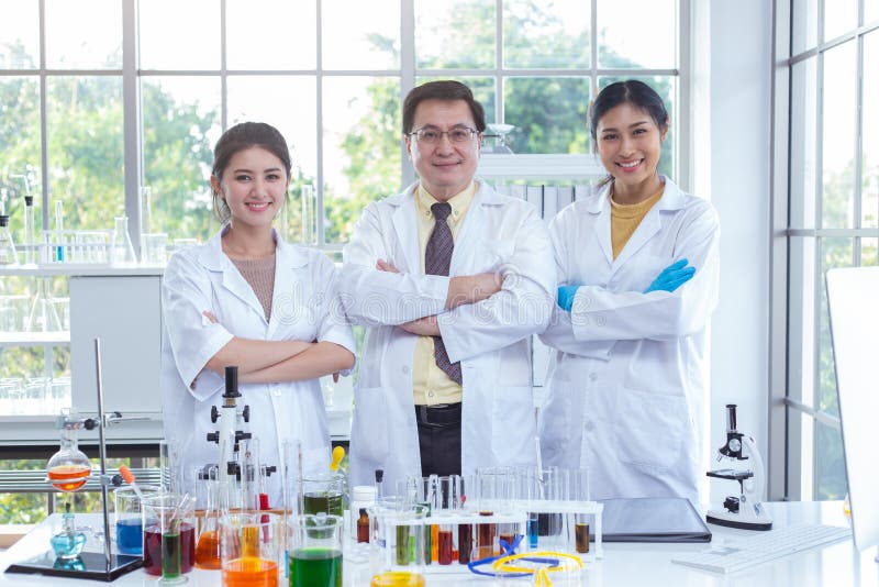 Scientists Showing Teamwork in Laboratory. Stock Photo - Image of ...