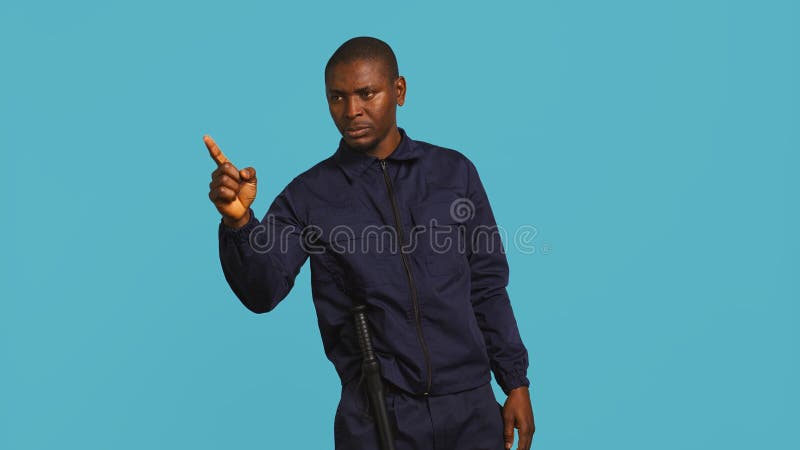 Portrait of Security Agent Pointing Finger at People, Warning Them ...
