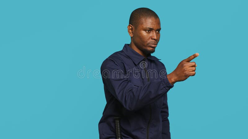 Portrait of Security Agent Pointing Finger at People, Warning Them ...
