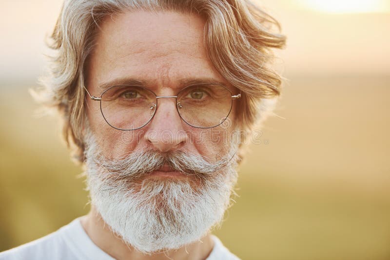Portrait Of Seenior Stylish Man With Grey Hair And Beard That Standing