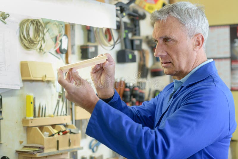 Portrait Senior Carpenter Sitting in Workshop Stock Photo - Image of ...