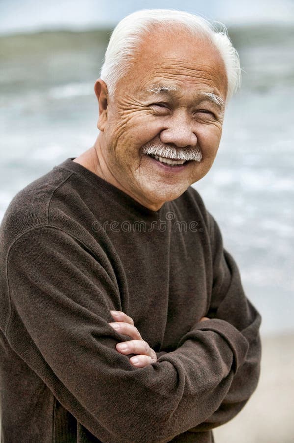 Portrait of Senior Chinese Man Standing on the Beach Stock Photo ...