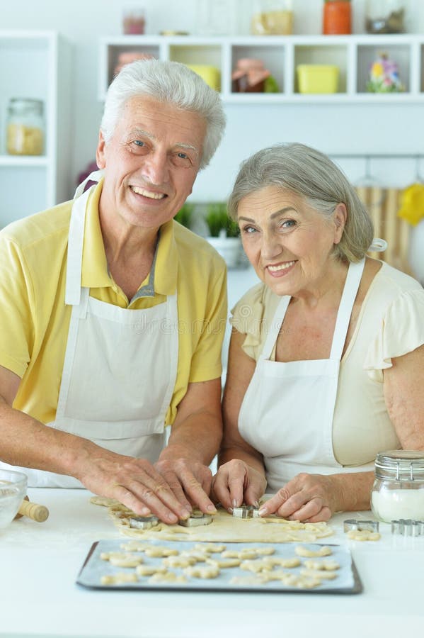 Portrait of Senior Couple Baking in the Kitchen at Home Stock Photo ...