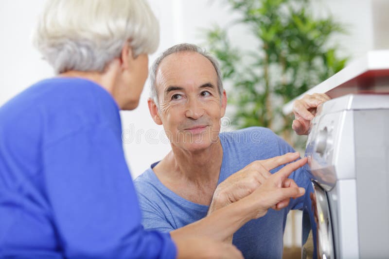 Portrait Senior Couple with Washing Machine Stock Image - Image of ...