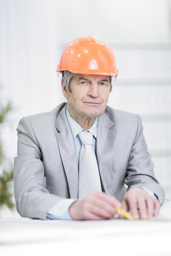 Portrait of a Senior Engineer Sitting at His Desk Stock Image - Image ...