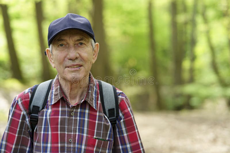 Portrait of an Elderly Man in a Cap and Plaid Shirt Stock Photo - Image ...