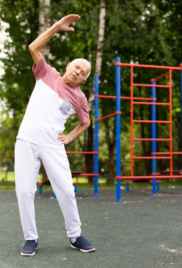 Portrait of Senior Man Doing Workout before Training in Park Stock ...