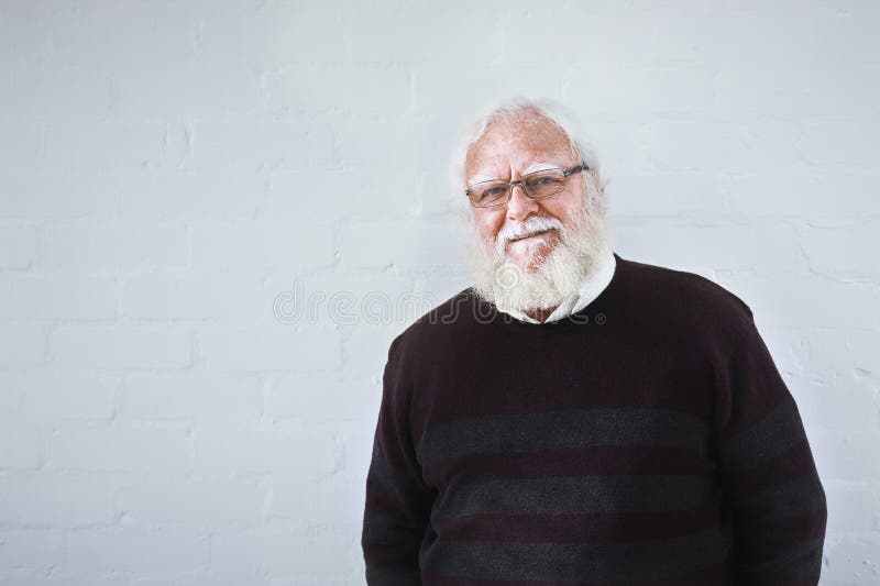 Portrait of Senior Man Isolated Against White Wall and Looking Forward ...