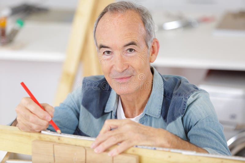 Portrait Senior Man Measuring Wood Stock Photo - Image of doityourself ...