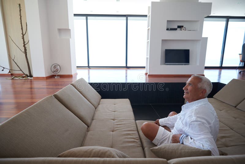 Portrait of Senior Man Relaxing in Sofa Stock Photo - Image of grey ...