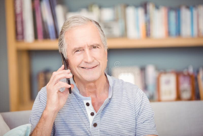 Portrait of Senior Man Using Mobile Phone Stock Photo - Image of home ...
