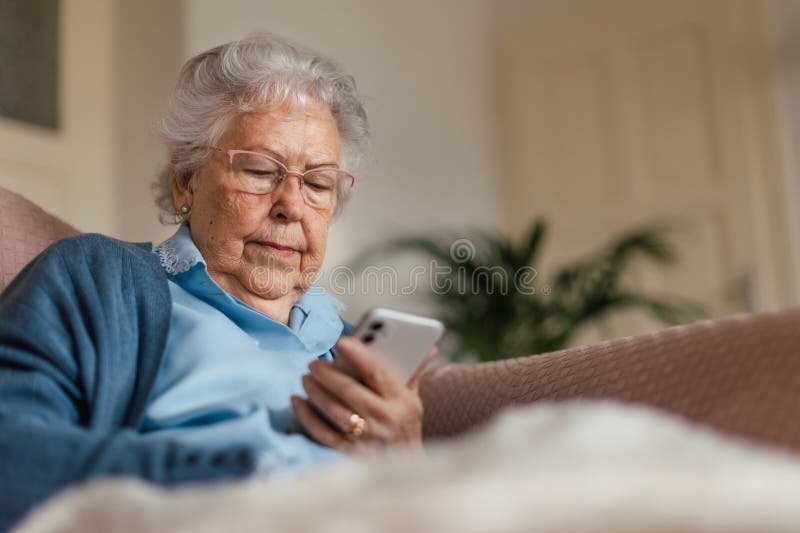 Portrait of Senior Woman Browsing on Her Smartphone. Stock Image ...