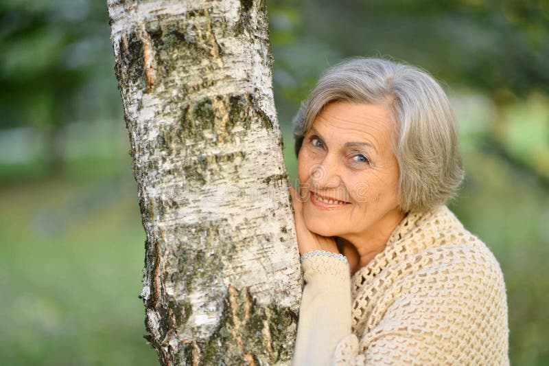 Portrait of Senior Woman by the Tree Stock Photo - Image of people ...