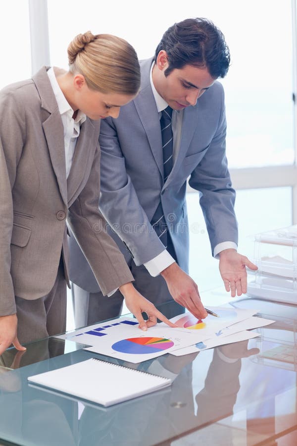 Portrait of Serious Business People Looking at Statistics Stock Photo ...