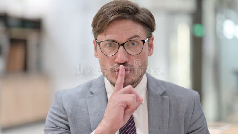 Portrait of Serious Businessman Putting Finger on Lips Stock Image ...