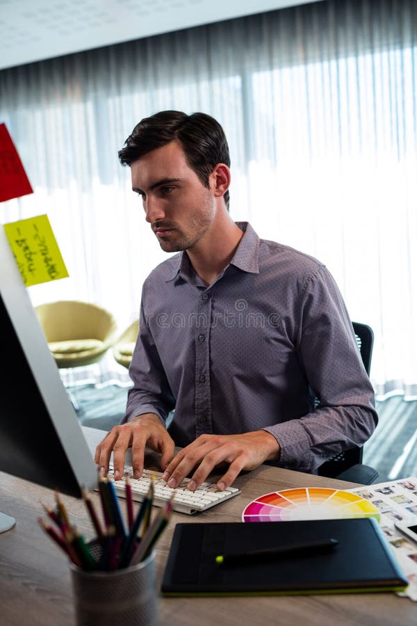 Portrait of Serious Casual Man Working at Computer Desk Stock Image ...