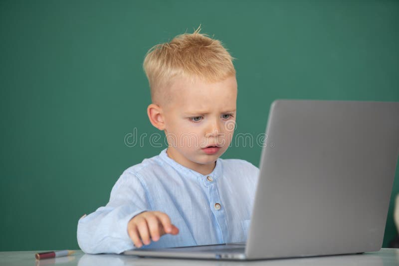 Portrait of Serious Concentrate Pupil School Boy Using Laptop. Stock ...