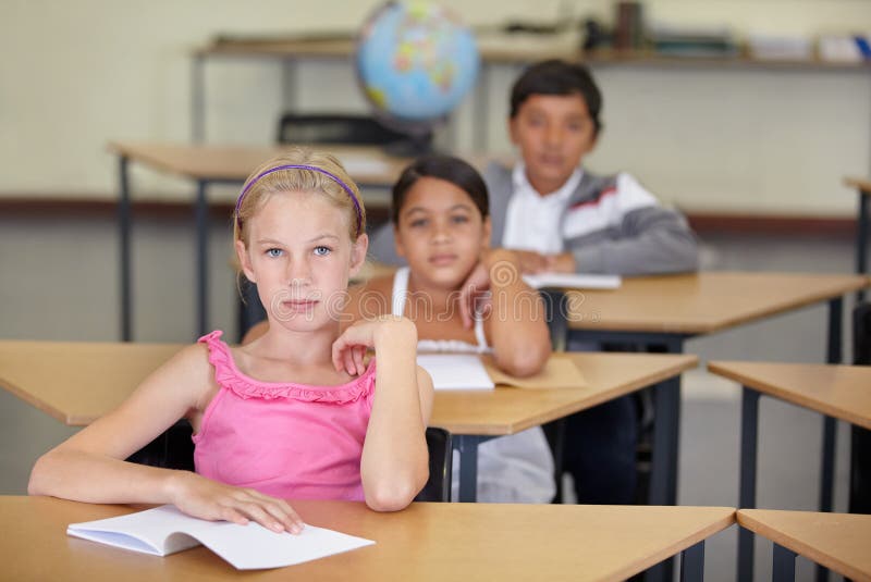 Portrait, Serious Kids and Student in Classroom with Book, Ready To ...