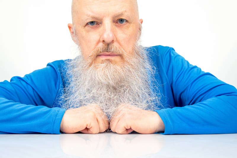 Portrait of a Serious Man with a Large Gray Beard on a Light Background ...
